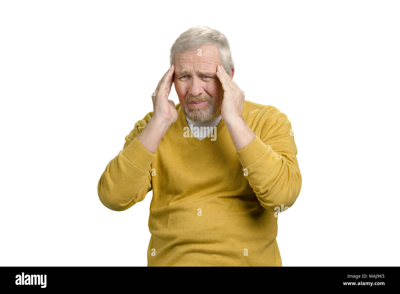 Old senior man has terrible headache. Touching head, feeling pain ...