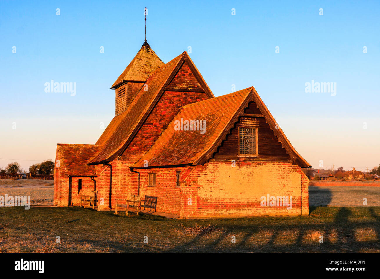England, Kent, Fairfield. St Thomas a Becket church on Romney Marsh lit ...