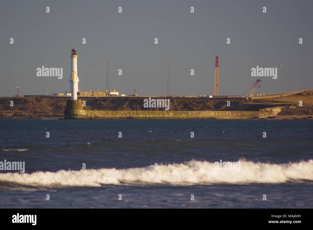 Girdleness Lighthouse and Aberdeen Harbour Wall in the Golden Light of ...