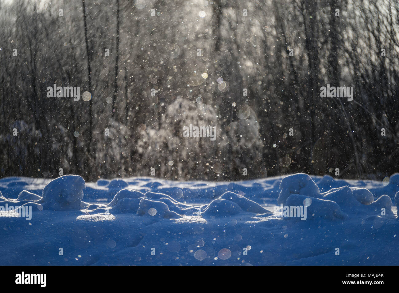 snow flakes falling in blizzard with white snow background with shadows ...