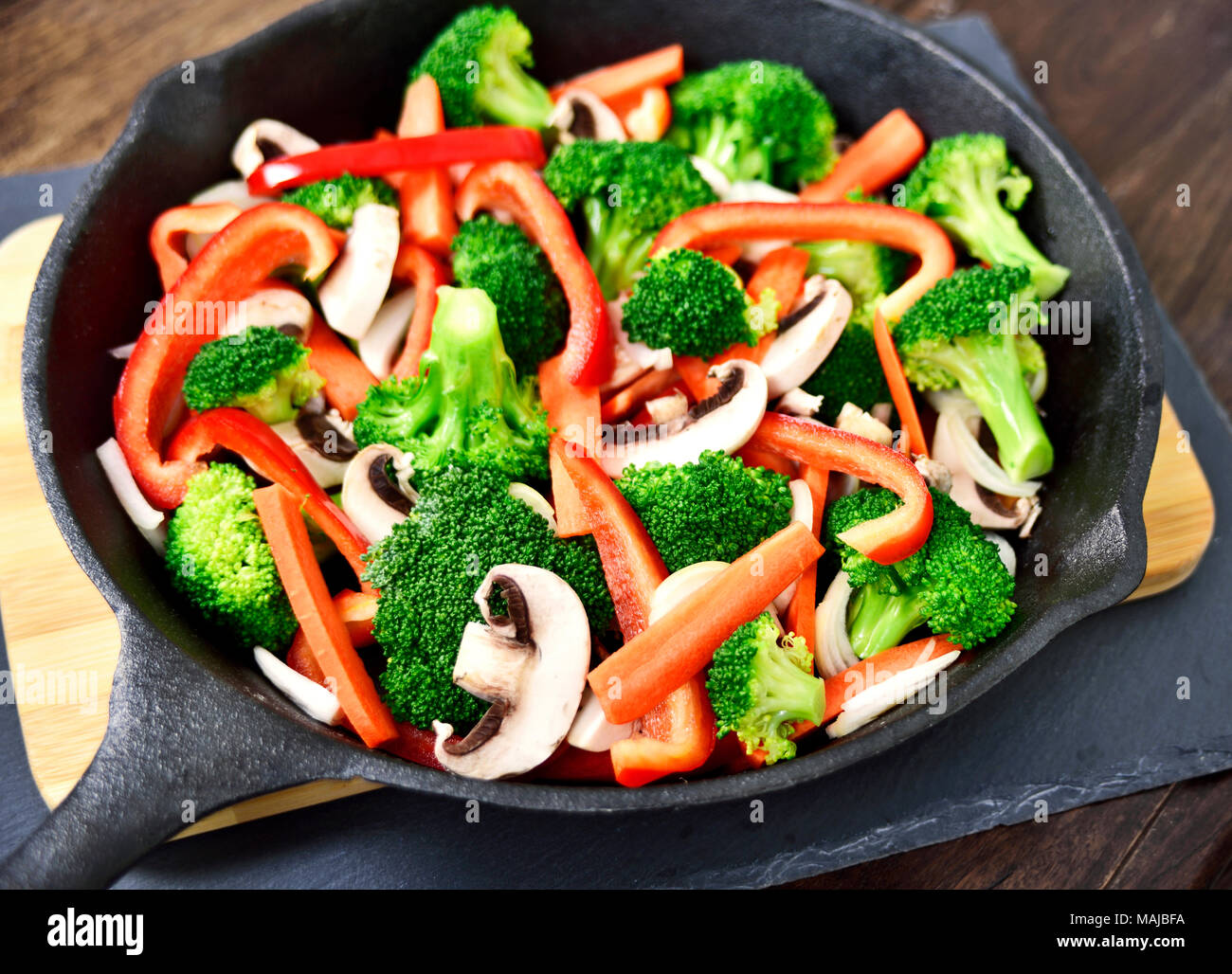 Healthy eating scene with vegetables in an iron pan or cooking pan ...