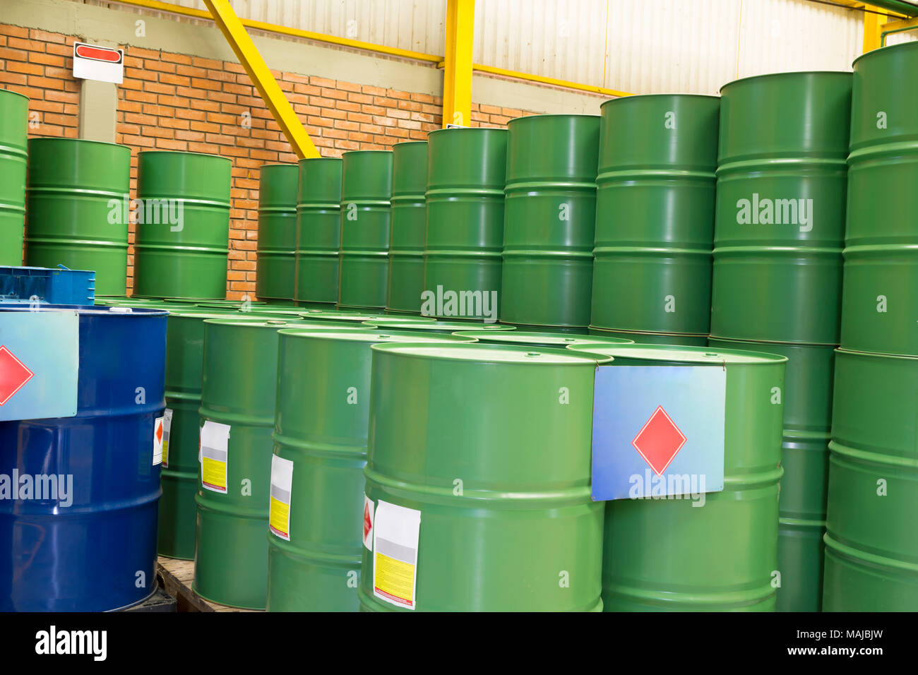 Green barrels or chemical drums stacked up Stock Photo - Alamy