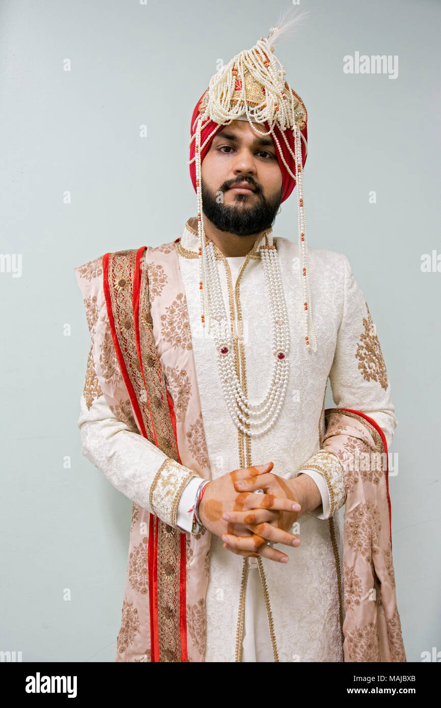 A Sikh groom visits a temple on his wedding day. At the Gurdwara Sikh ...