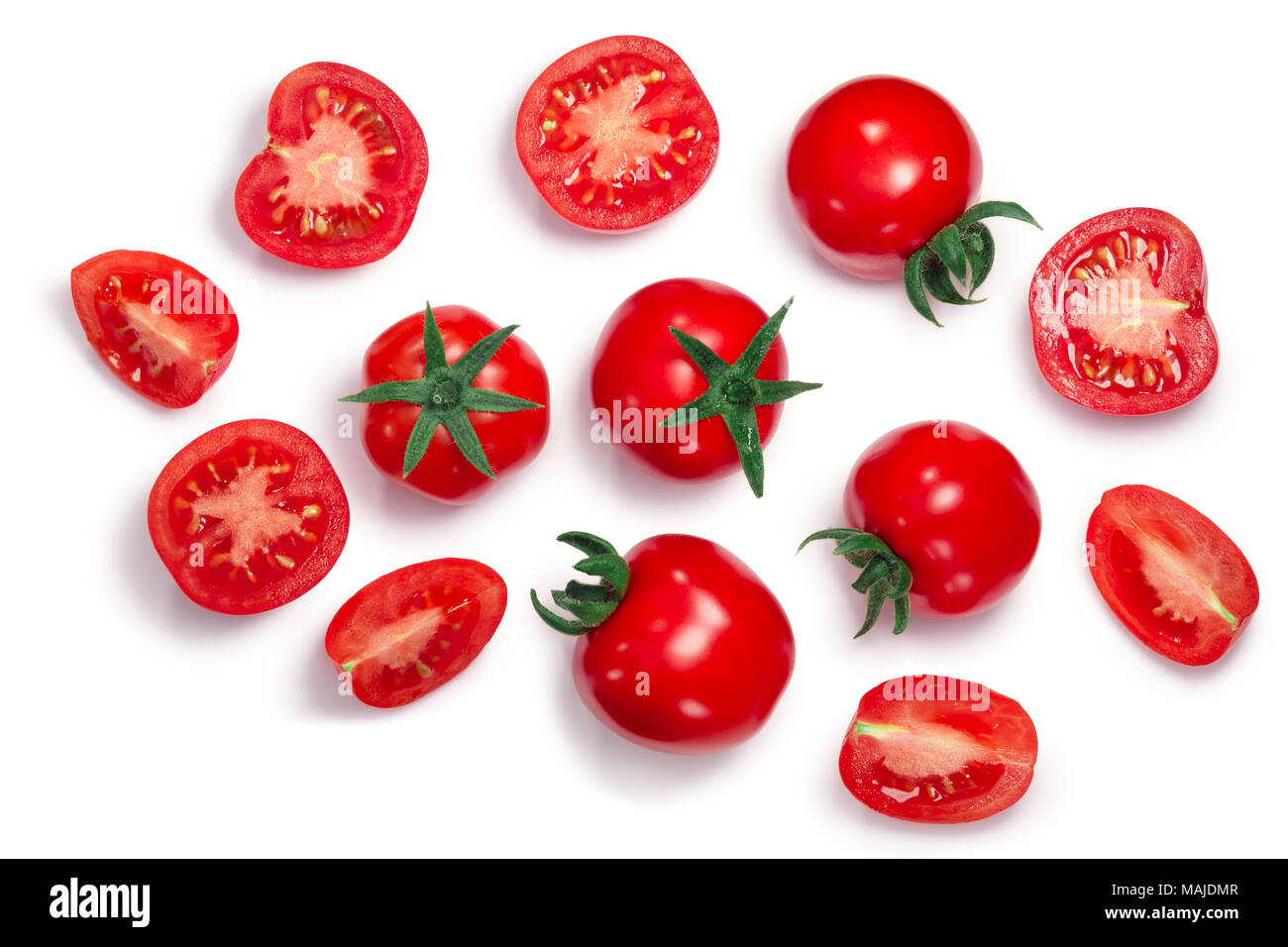 Middle globe tomatoes, whole and sliced, top view. Clipping paths ...