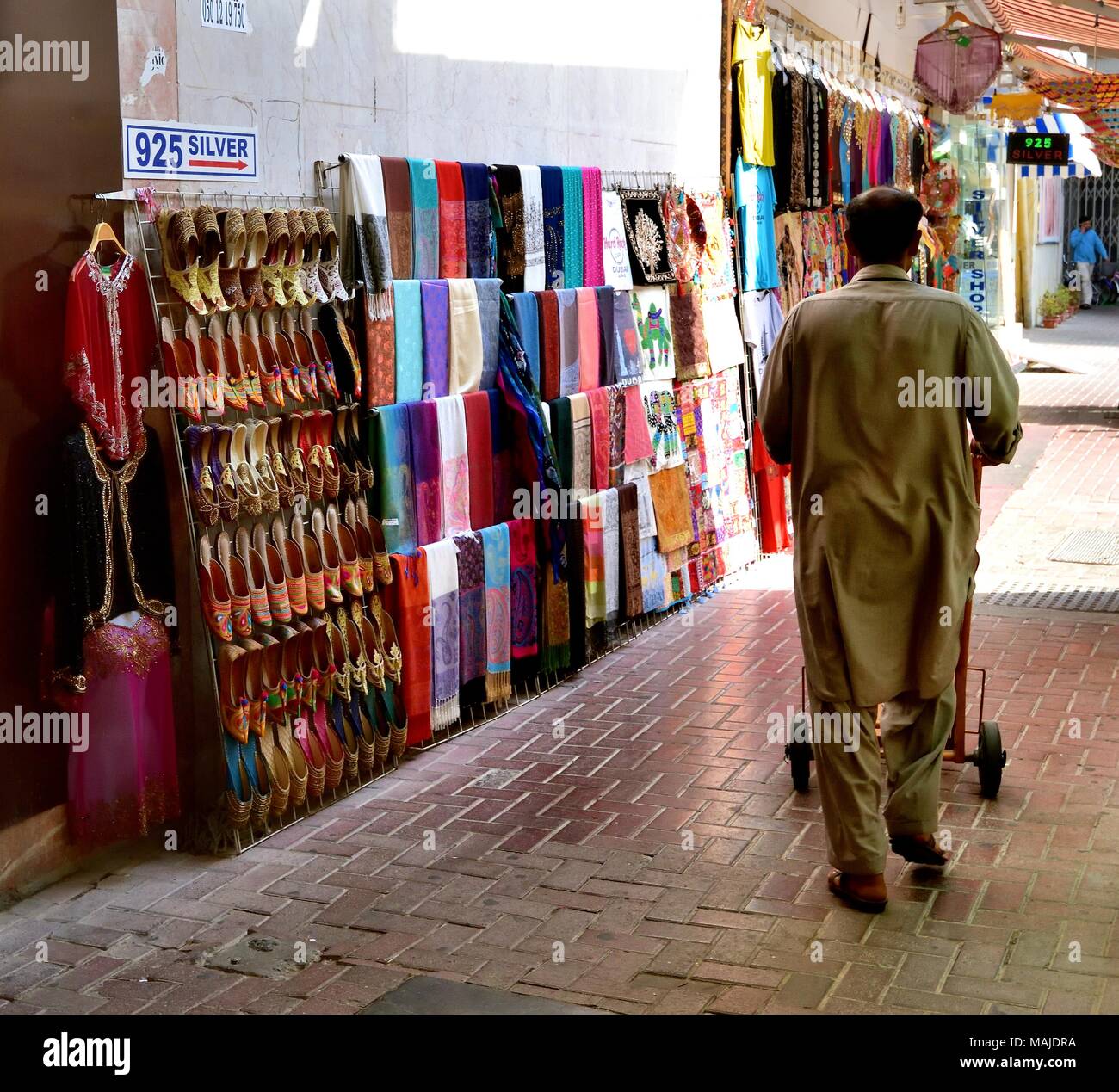 Dubai, United Arab Emirates - January 2017:worker with trolley walking ...