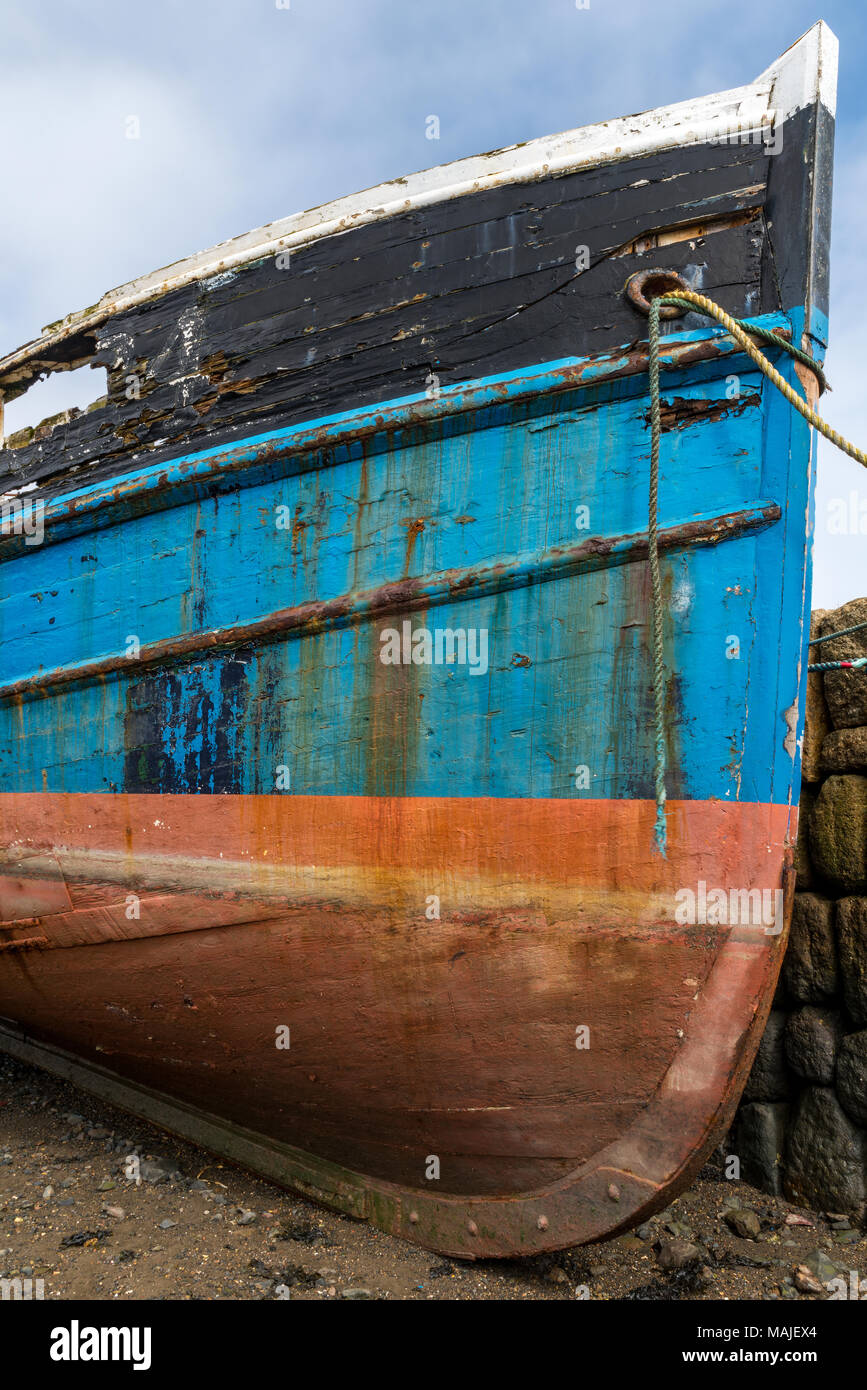 the bows and hull of an old disused abandoned fishing trawler in the ...