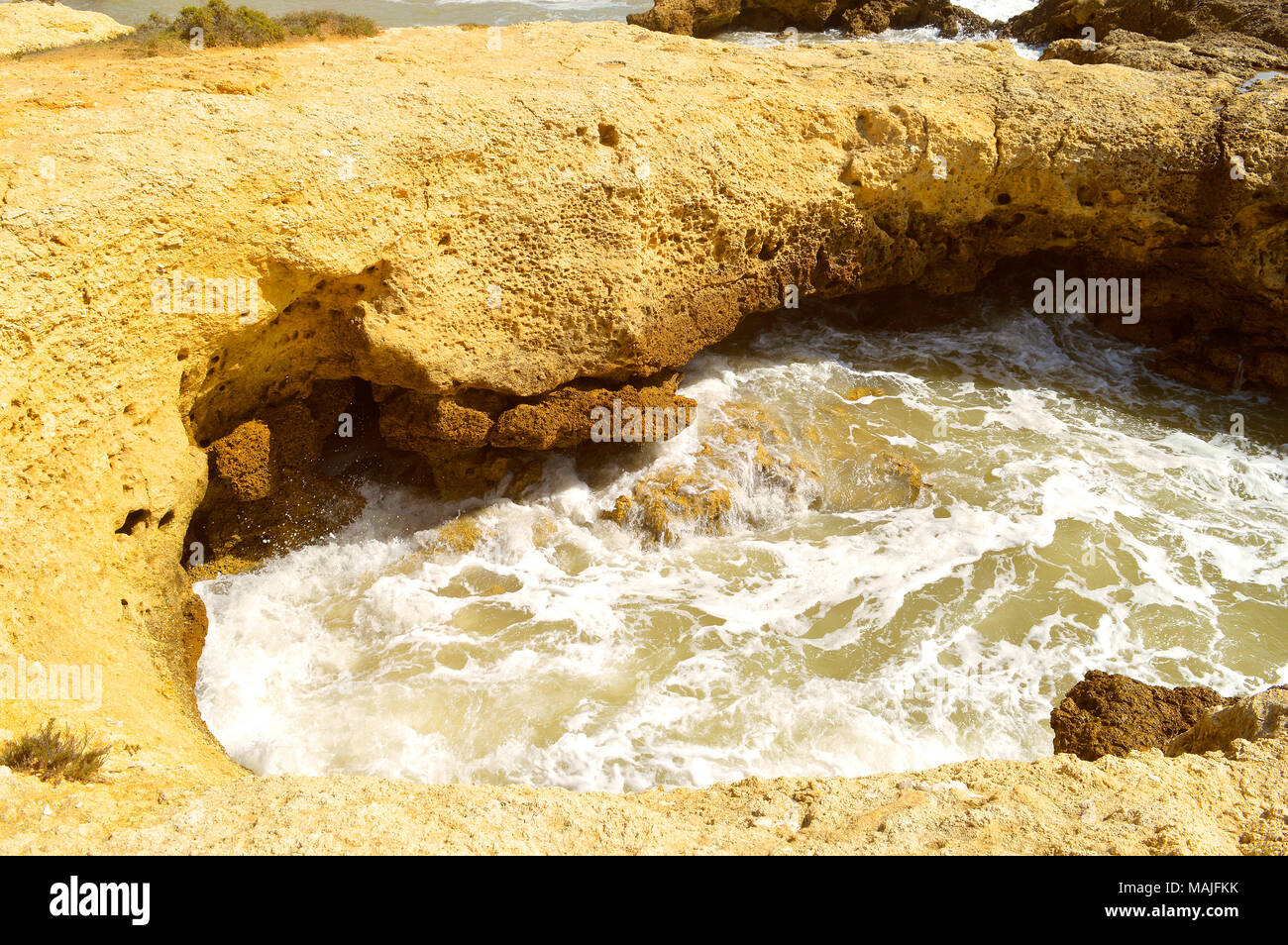 Rock erosion from the sea on Auramar beach in Albufeira Stock Photo - Alamy
