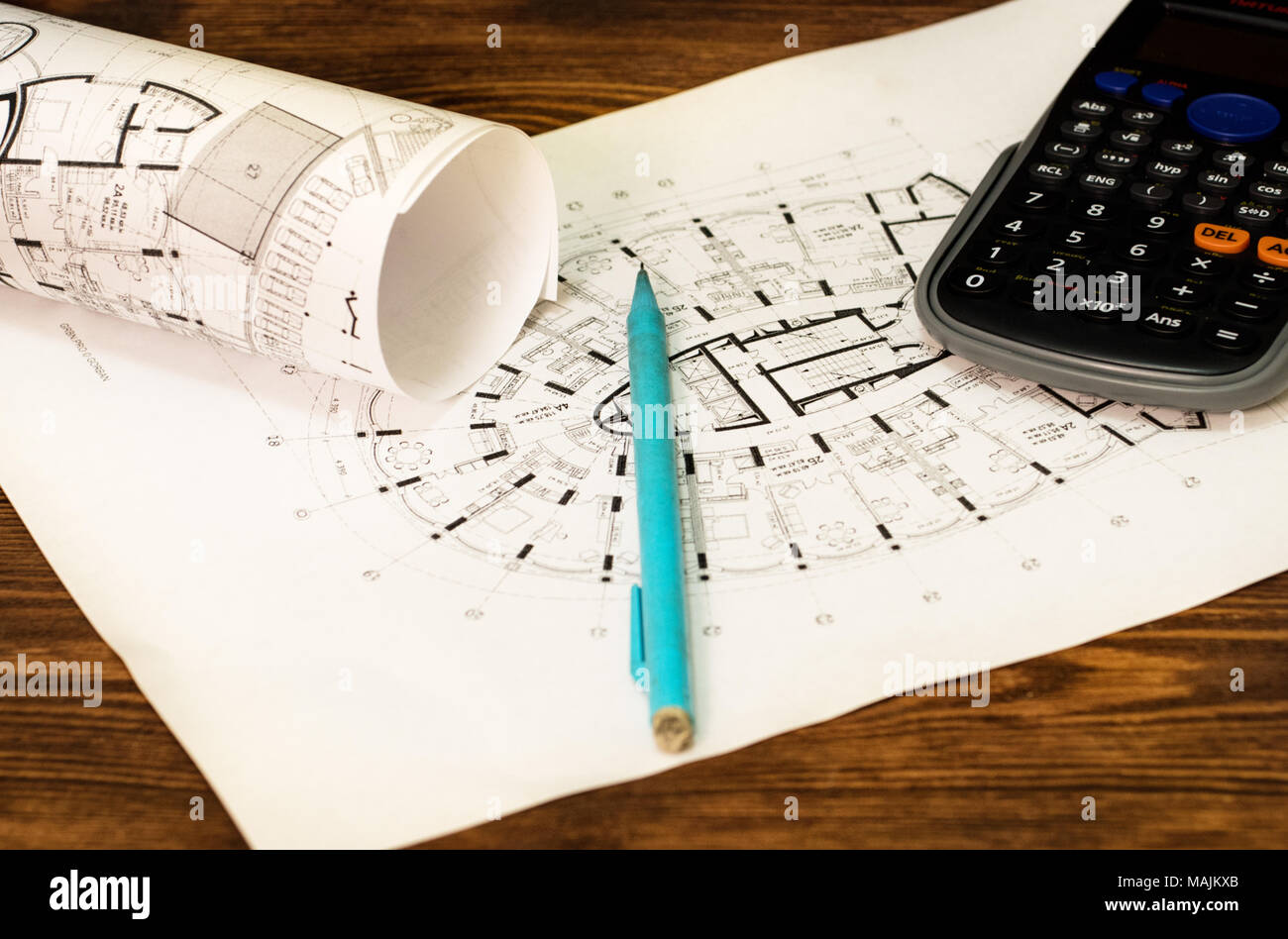 Construction plot/drawing, black calculator, blue pencil on the wool ...