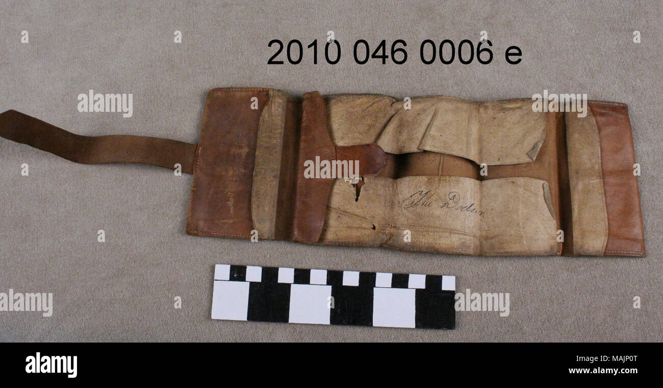 Folded brown leather wallet used by Pvt. Theodore Dodson of the 61st ...