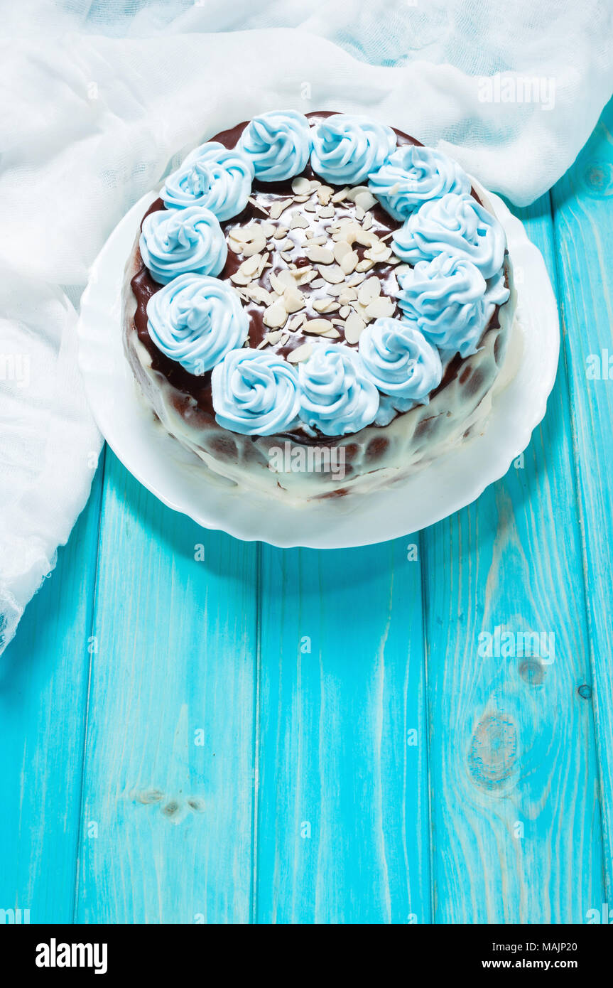 Cake with blue cream on wood background. Blue cake Stock Photo - Alamy