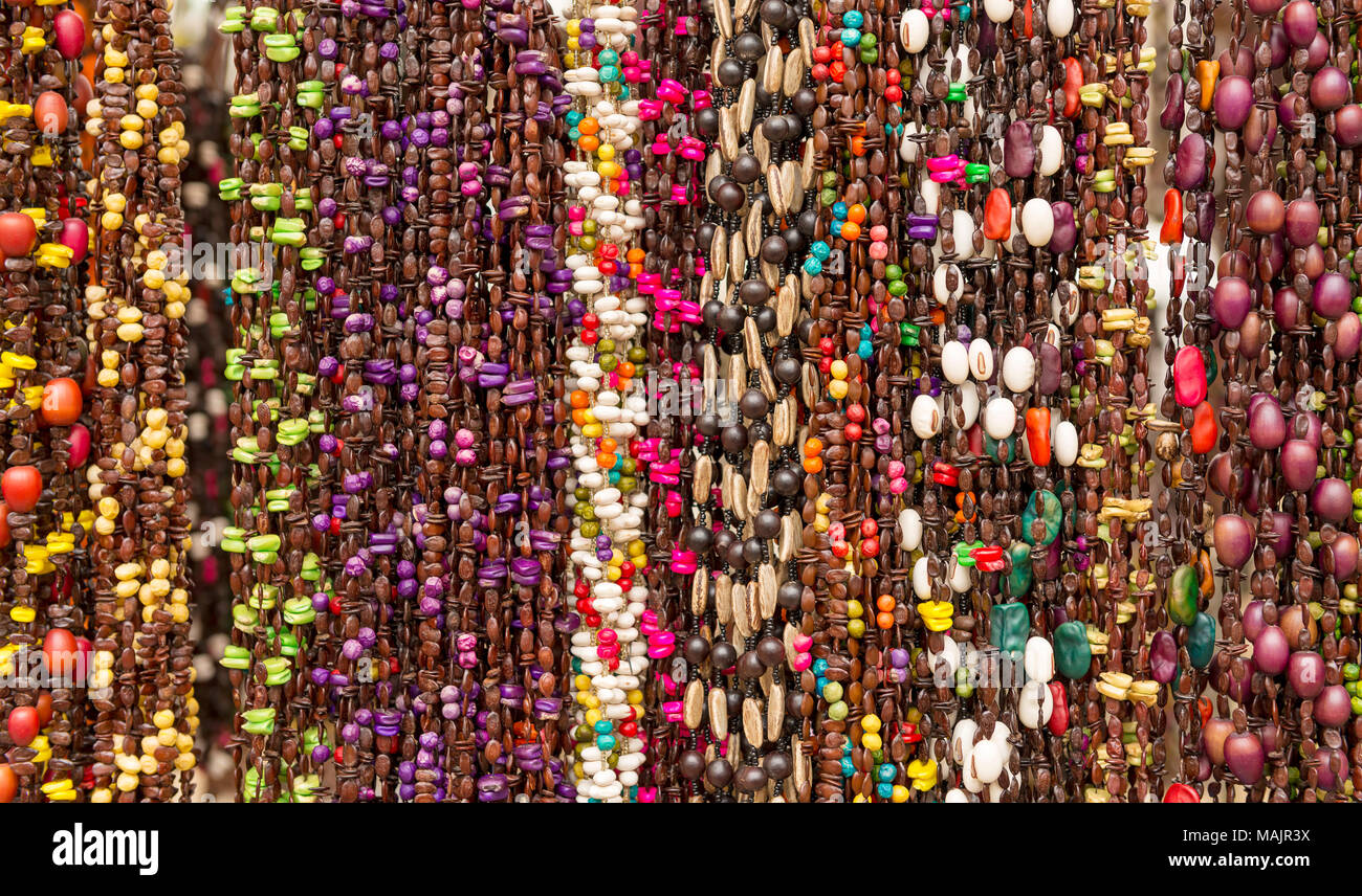 Strings of colorful beads in a local market as a background pattern ...