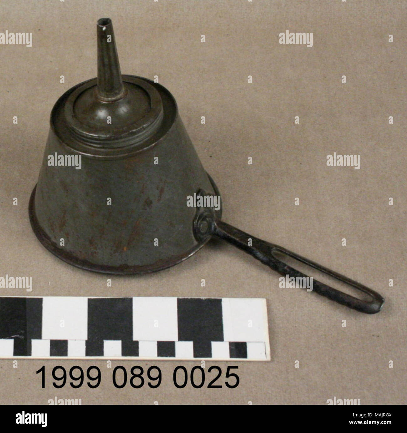 Metal two-tiered combination funnel dipper with handle, 1891. Title ...