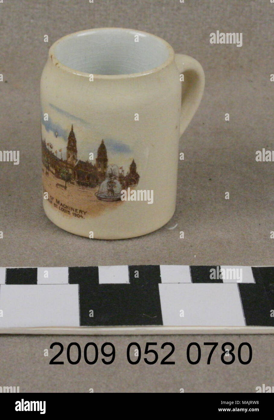 Miniature cream colored ceramic stein without lid showing a color ...