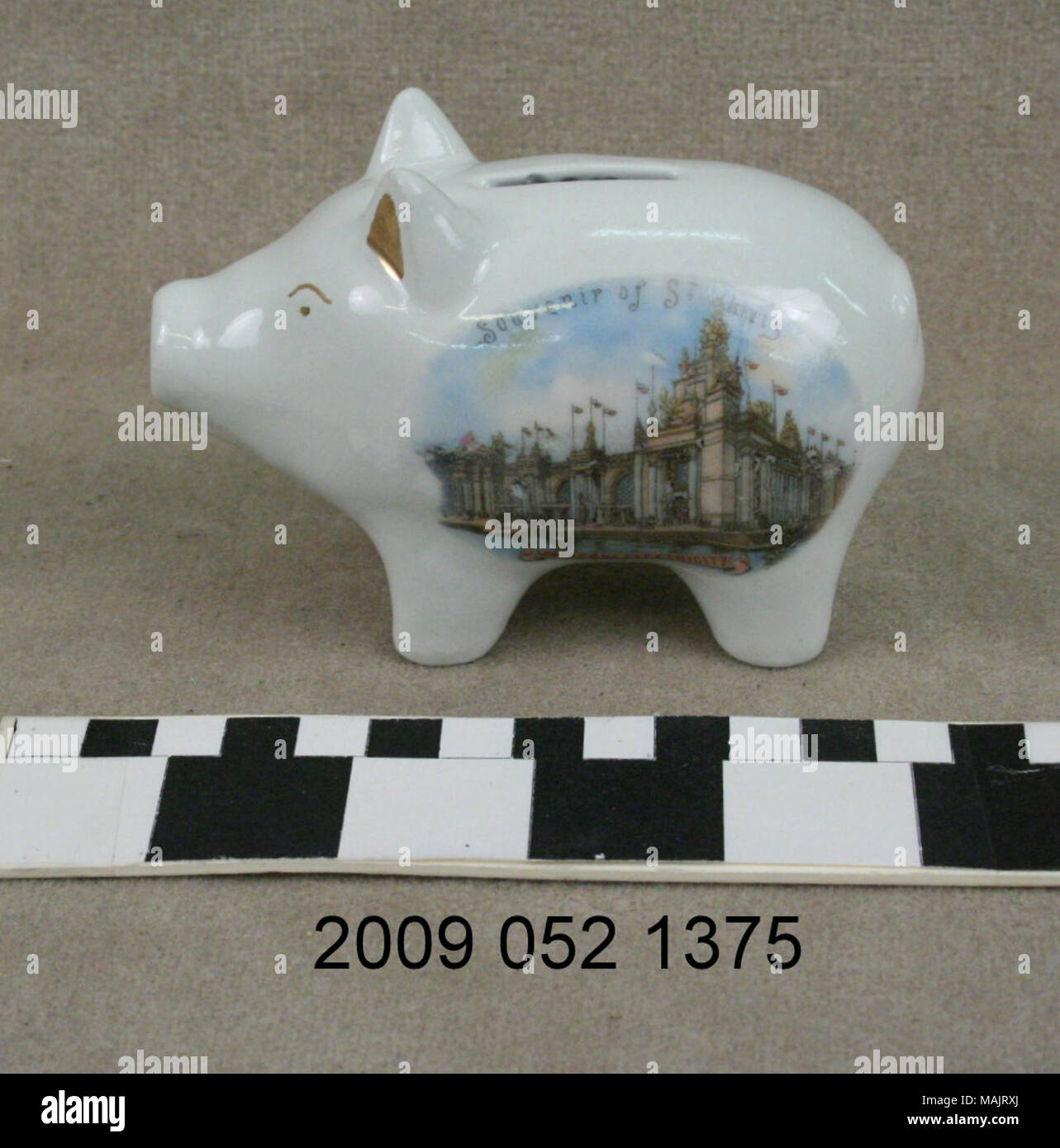 Small white ceramic pig bank with color transfer of Palace of ...
