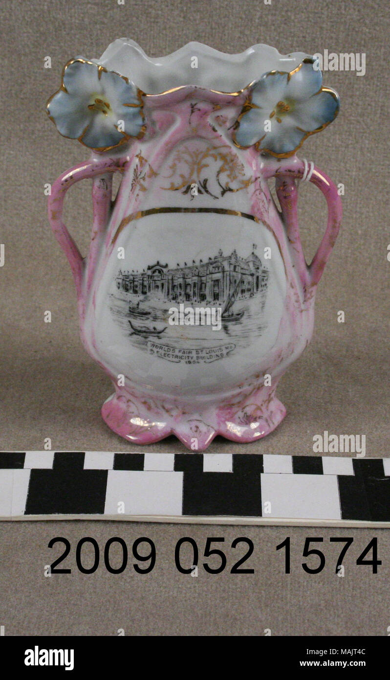 Small white ceramic bank shaped like a barrel shows a color transfer of ...