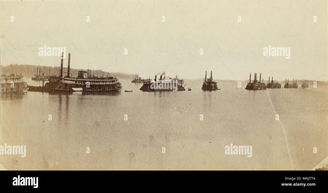 Photograph of several ironclad and tinclad naval vessels in the river ...