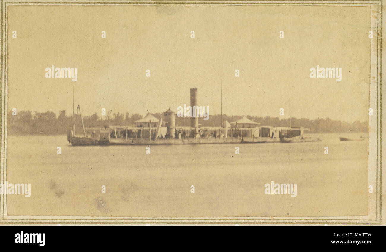 Photograph of a double-turret U.S. Monitor gunboat. The turrets have ...