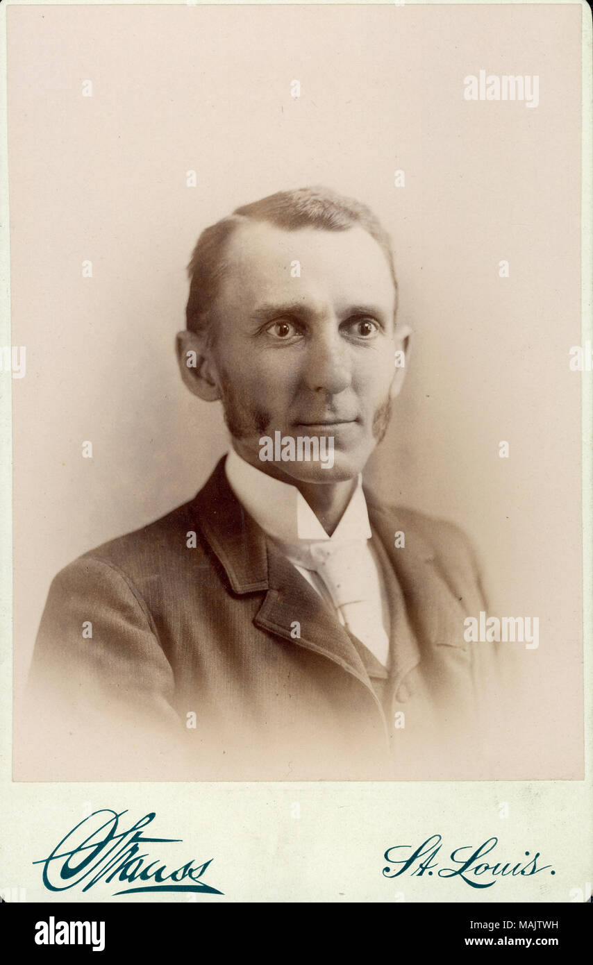 Bust portrait of Harry Hodgen wearing a suit and tie, and turned to the ...