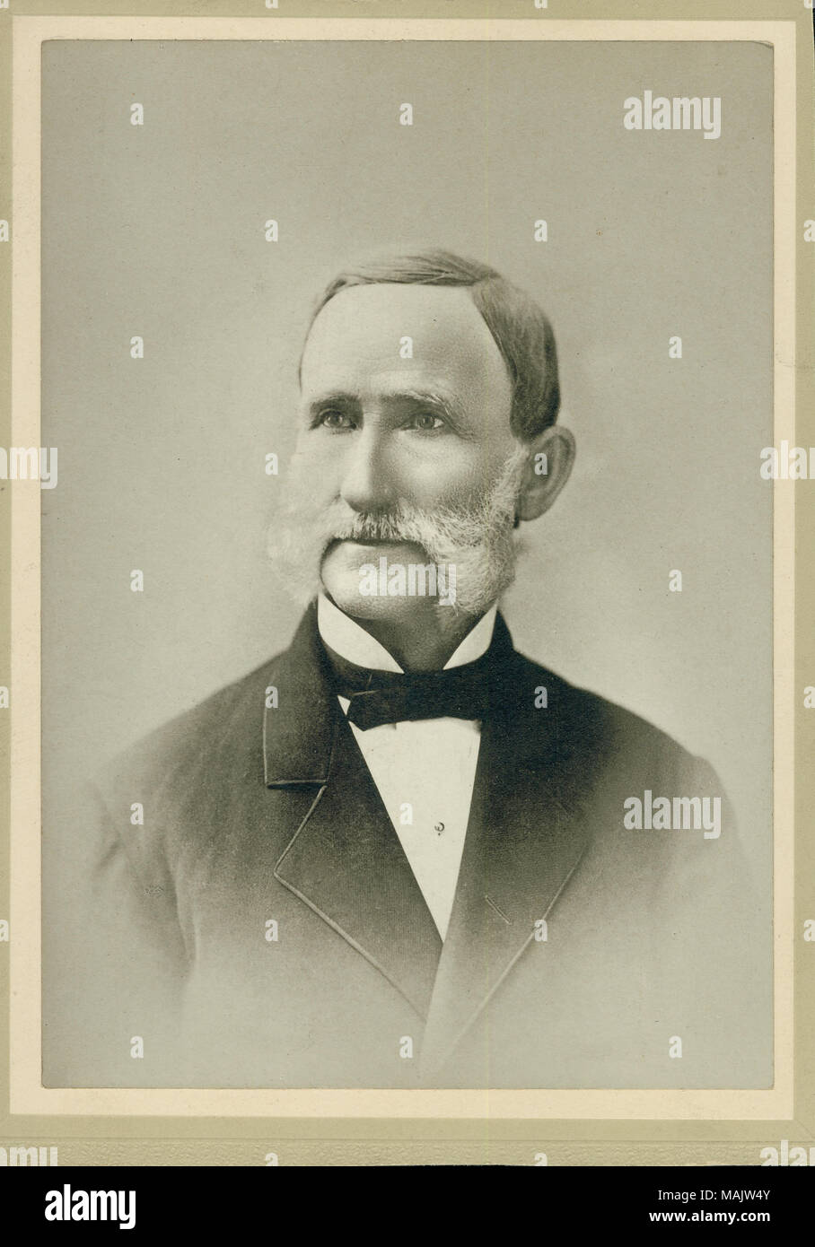 Bust portrait of Carlos S. Greeley wearing a suit and bow tie, with his ...