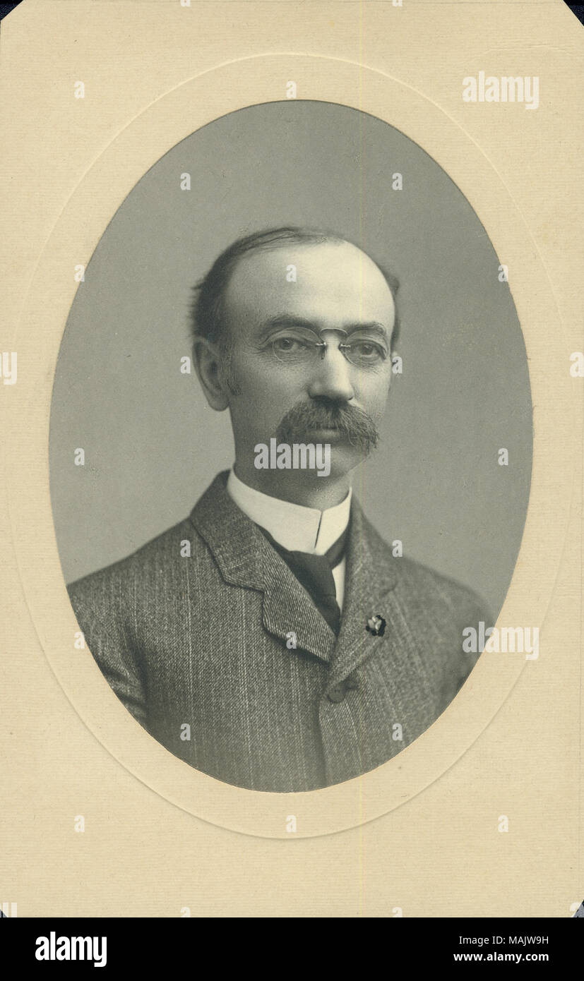 Bust portrait of S.W. Kniffin wearing a suit, tie, and glasses, and ...
