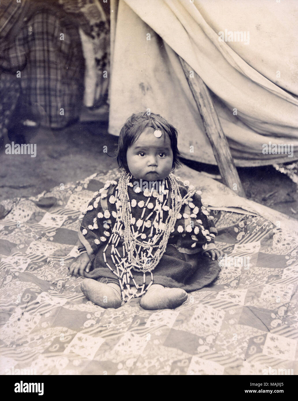 Title: Cheyenne baby with lucky charm. Department of Anthropology, 1904 ...