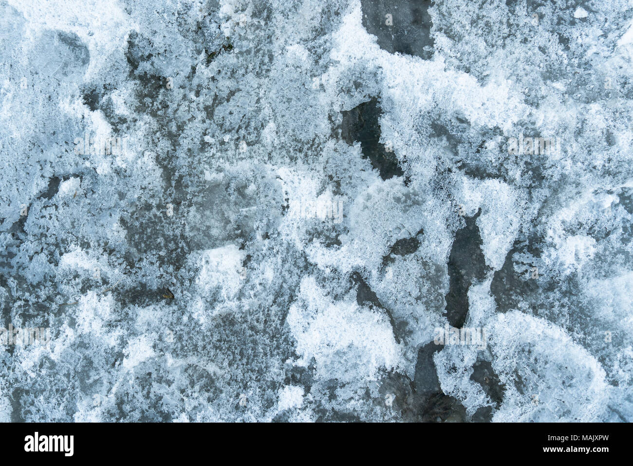 texture of ice crust in winter on the lake Stock Photo - Alamy