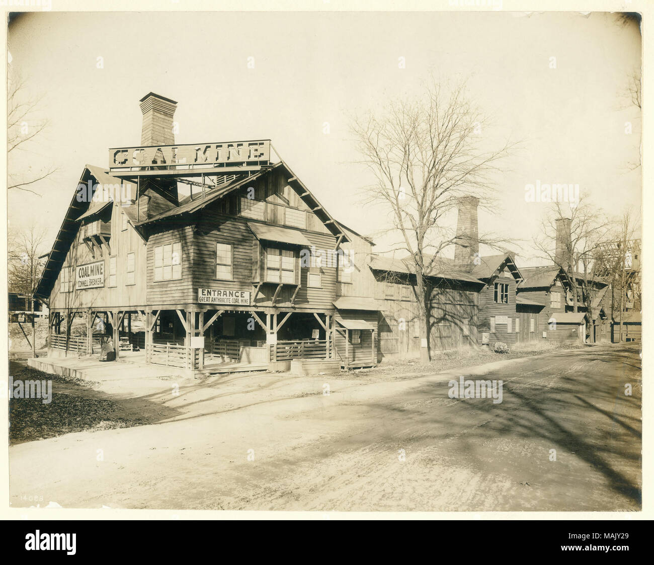 Horizontal sepia photograph showing a building with a large 'Coal Mine ...