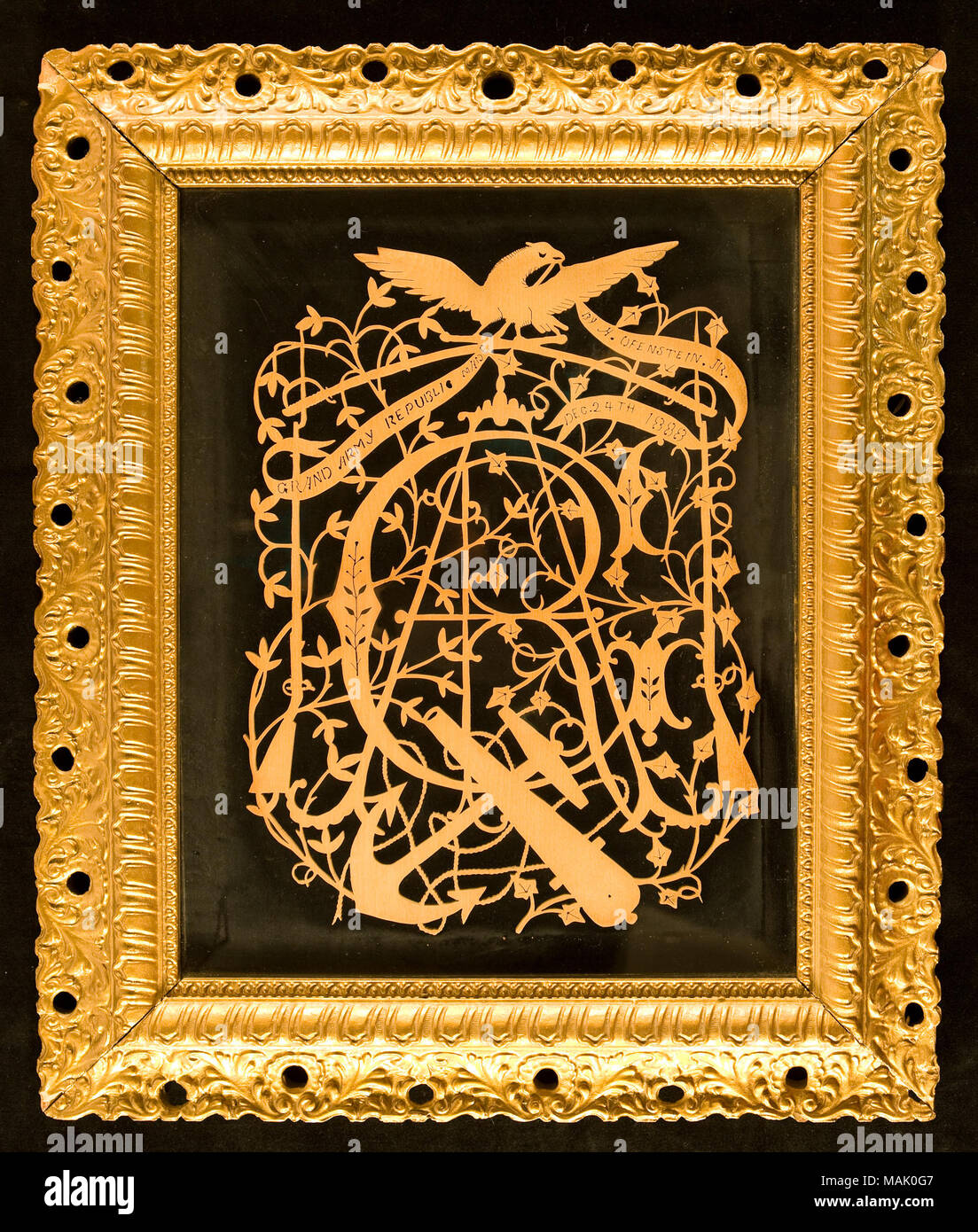 An elaborate and delicate scrollwork of a monogram for the Grand Army ...