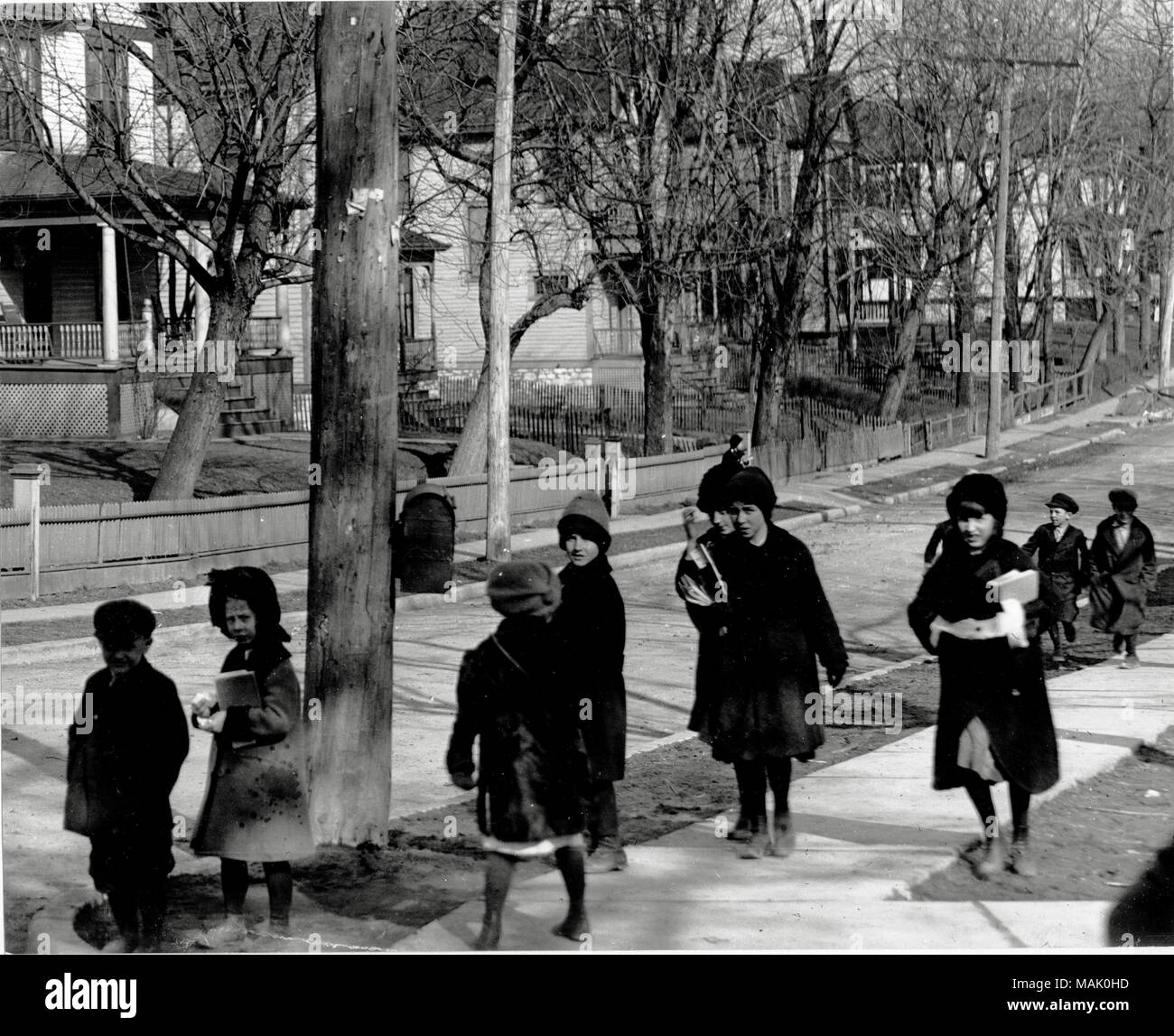 Title: A group of children in winter coats walking to or from school ...