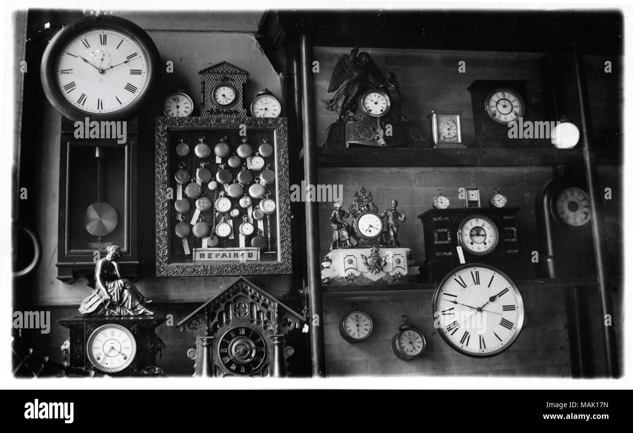 Photograph of a large number of clocks of various kinds and a case of ...