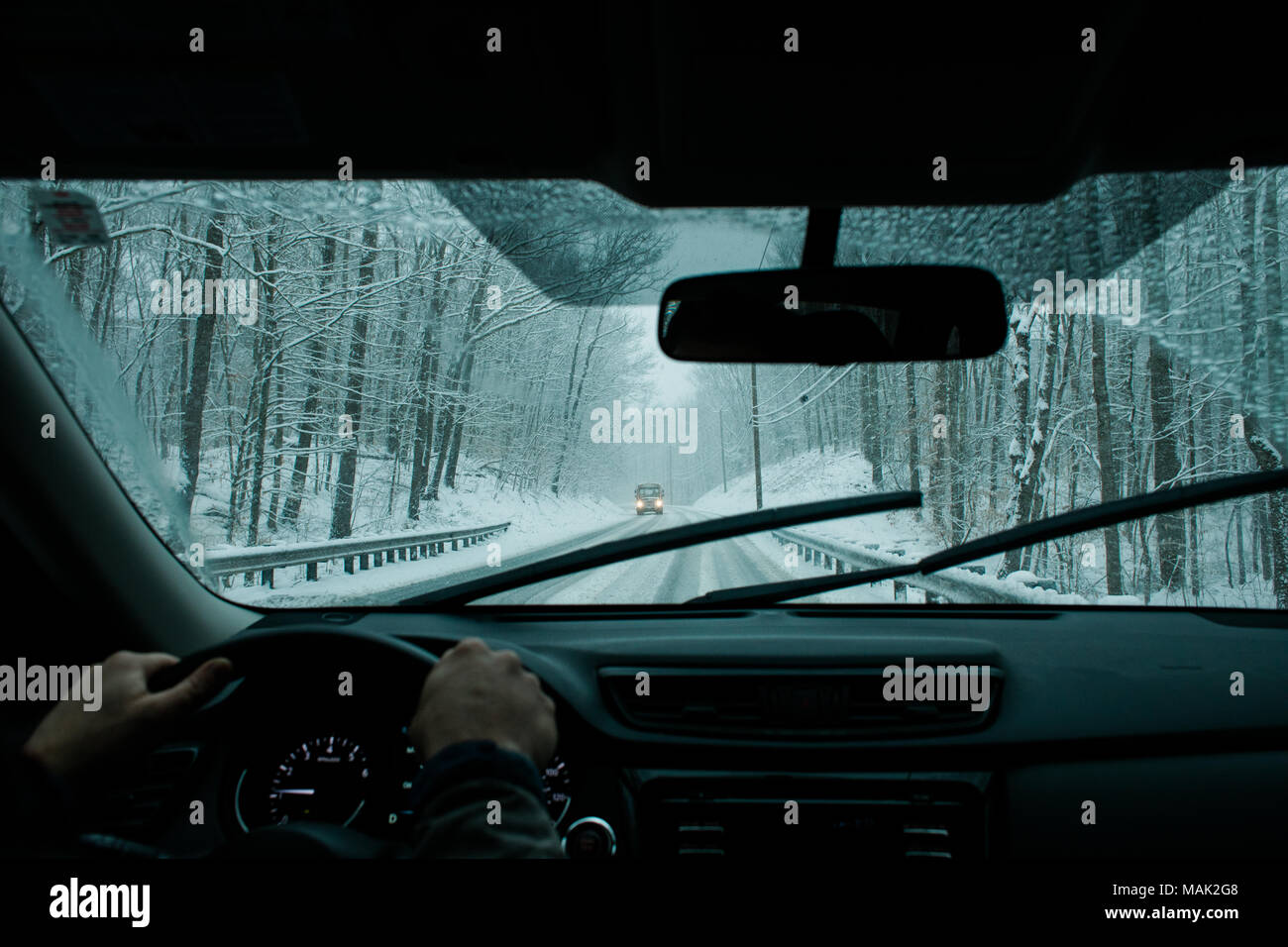 A commuter driving in a winter snow storm Stock Photo - Alamy