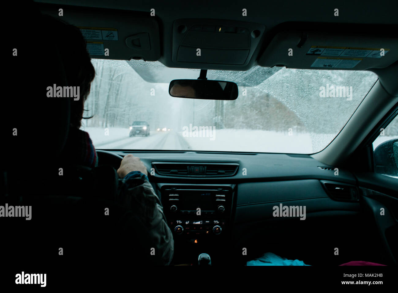 A commuter driving in a winter snow storm Stock Photo - Alamy
