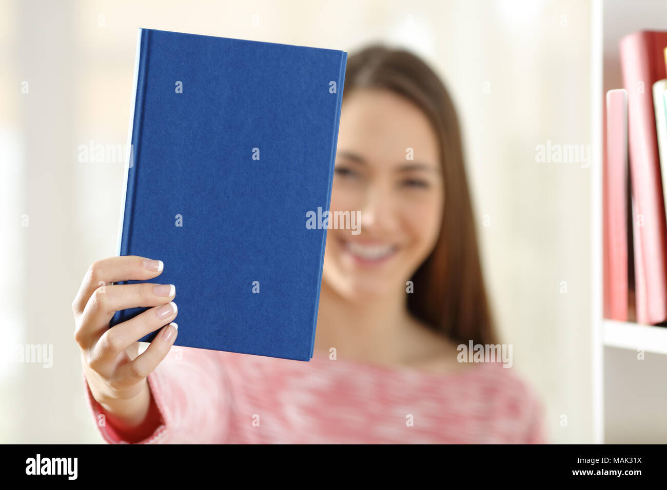 Person showing a book hi-res stock photography and images - Alamy