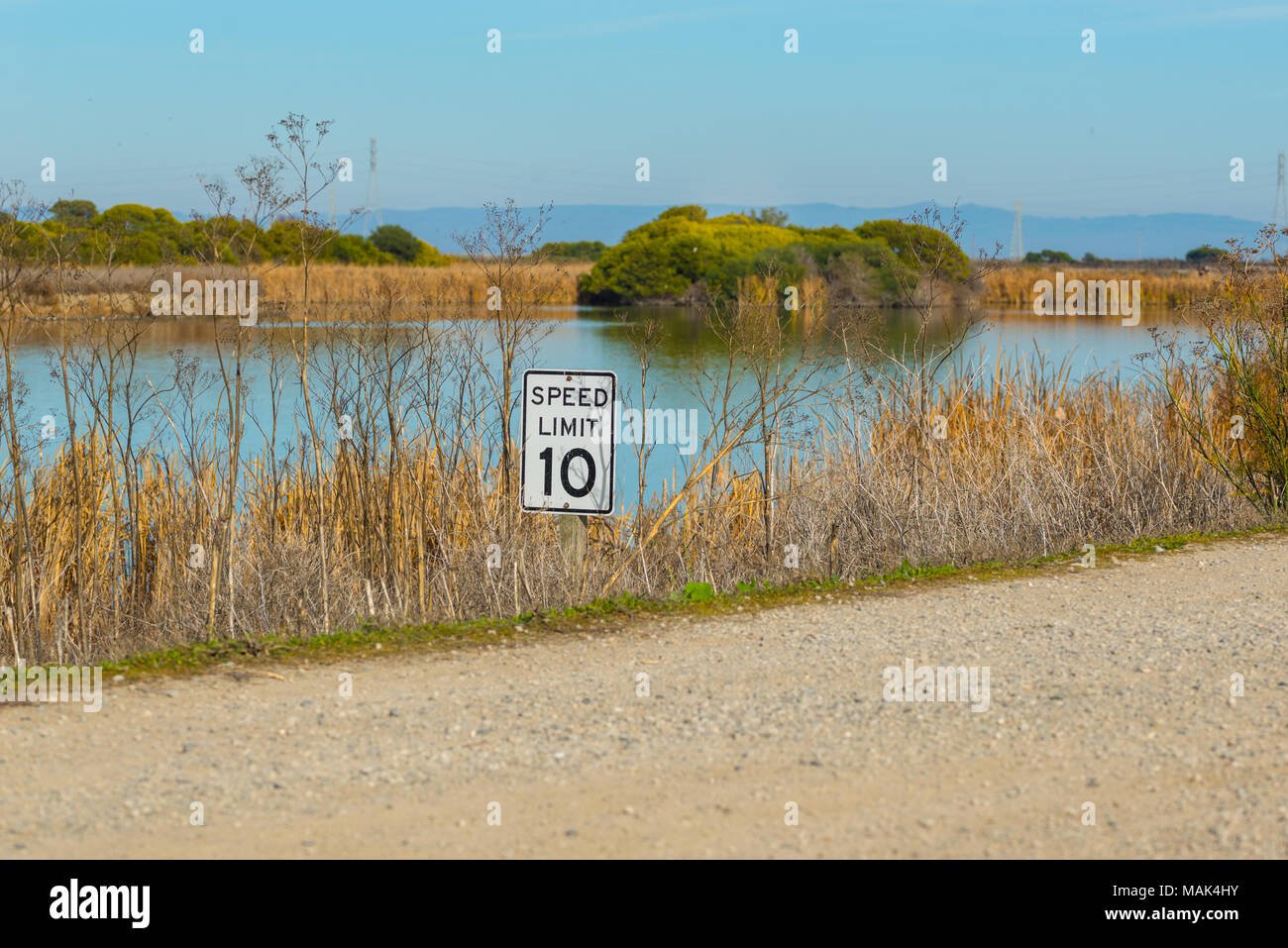 Speed Limit 10 at Landscape Trees and River and Blue Sky Stock Photo ...