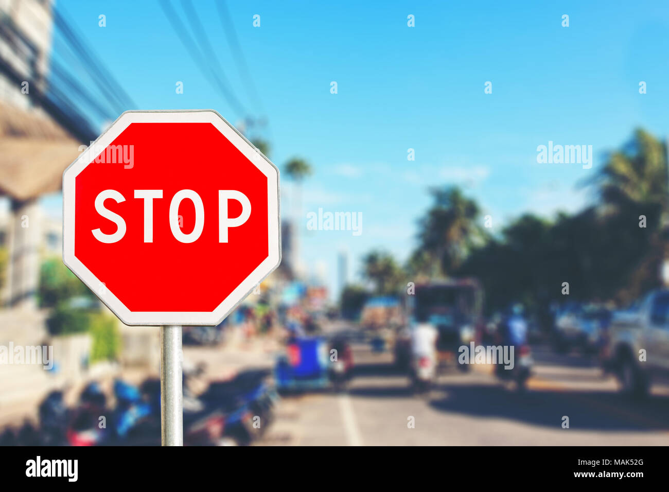 Stop sign by the City road Stock Photo - Alamy