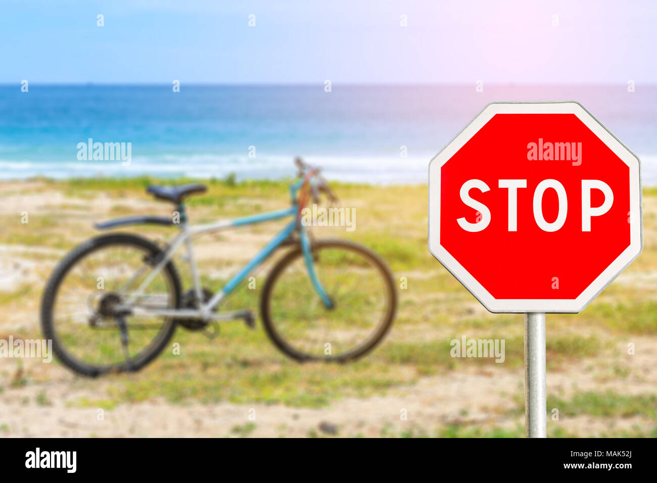 Stop sign by the sea and Parked bicycle on the beach in day time Stock ...