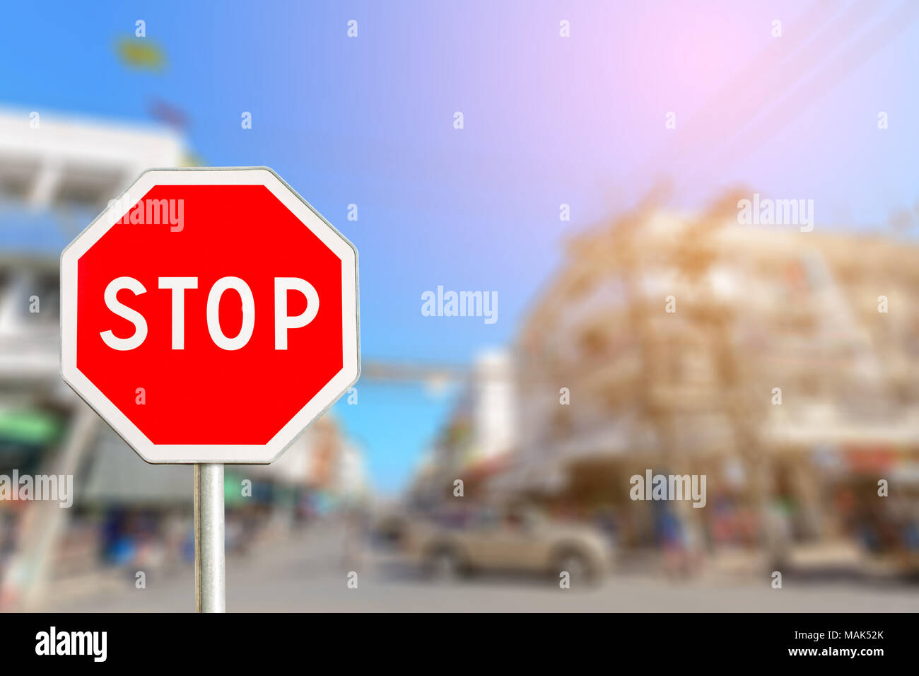Stop sign by the City road Stock Photo - Alamy