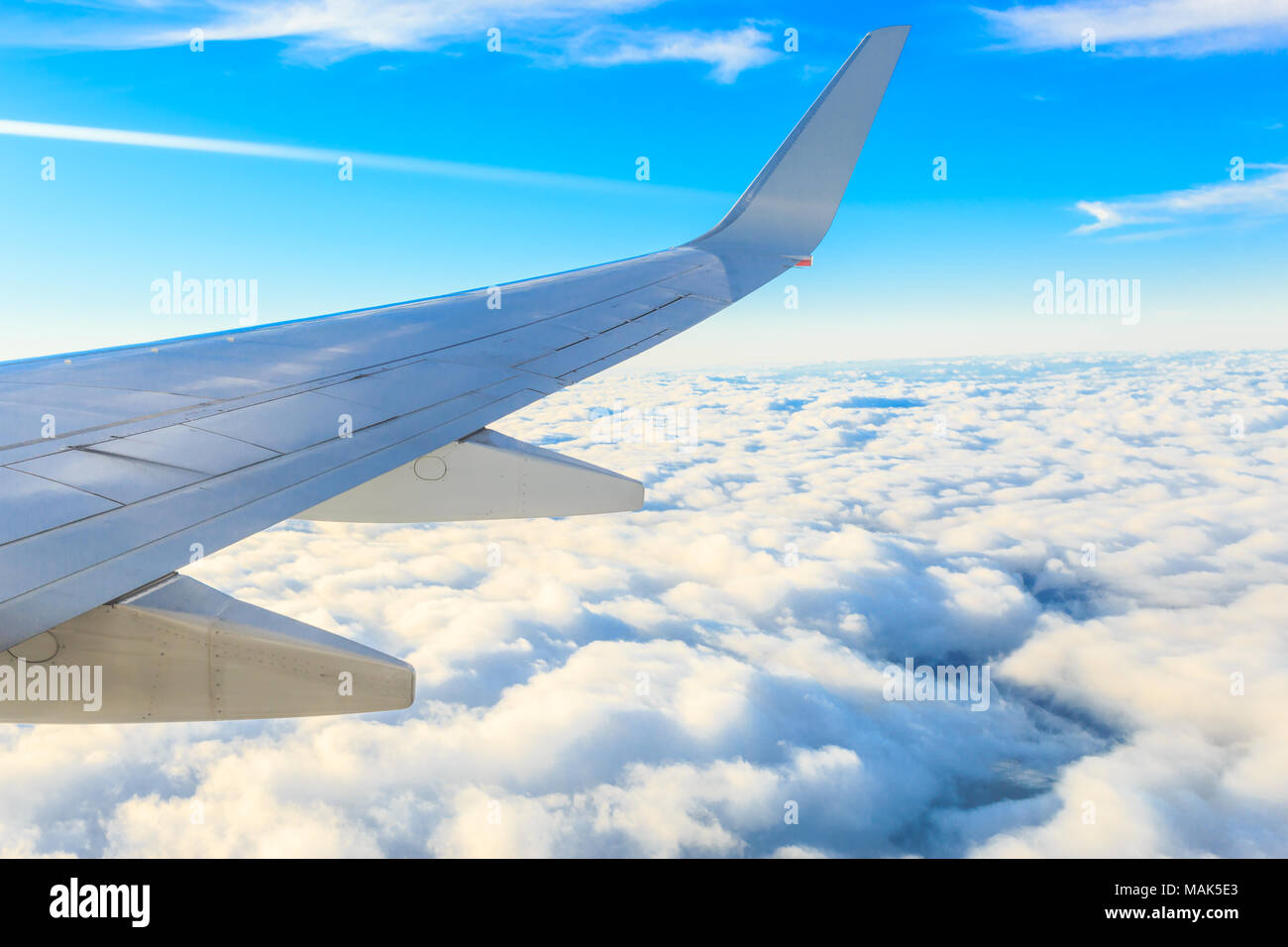 Airplane wing out of window Stock Photo - Alamy