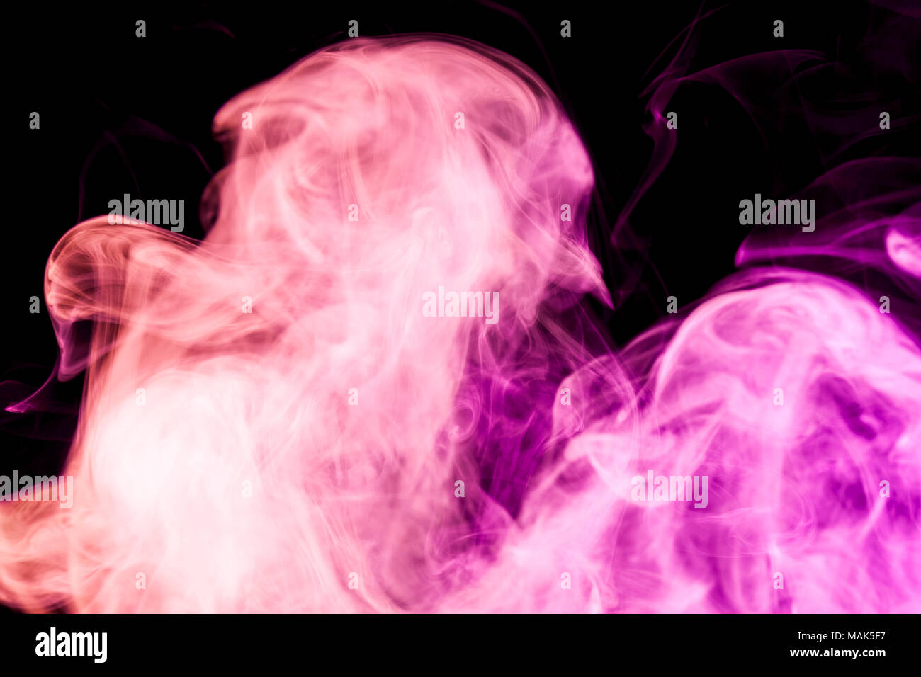 Colorful pink and red smoke on a black isolated background. Background ...