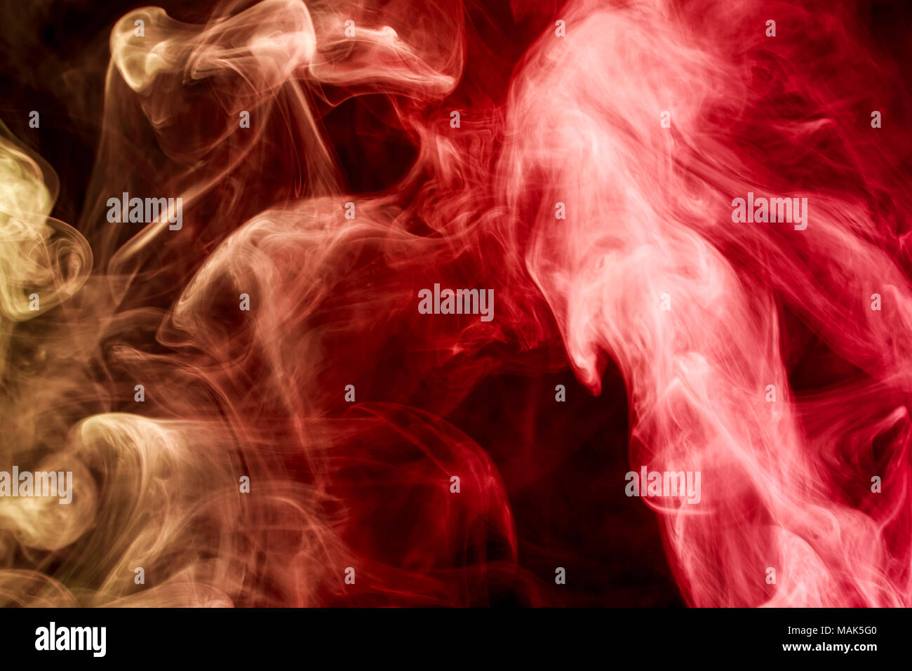 Colorful pink and red smoke on a black isolated background. Background ...