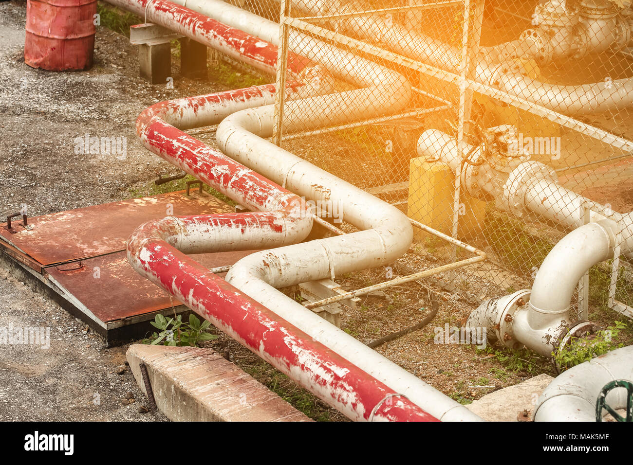 The bend of Oil pipeline with sunlight Stock Photo - Alamy