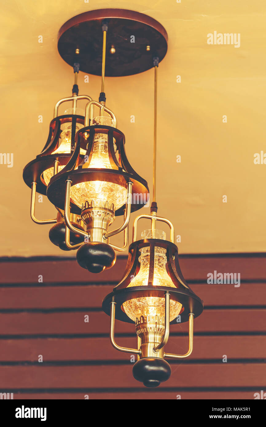 Yellow lamps with glass structure on ceiling in ballroom Stock Photo ...