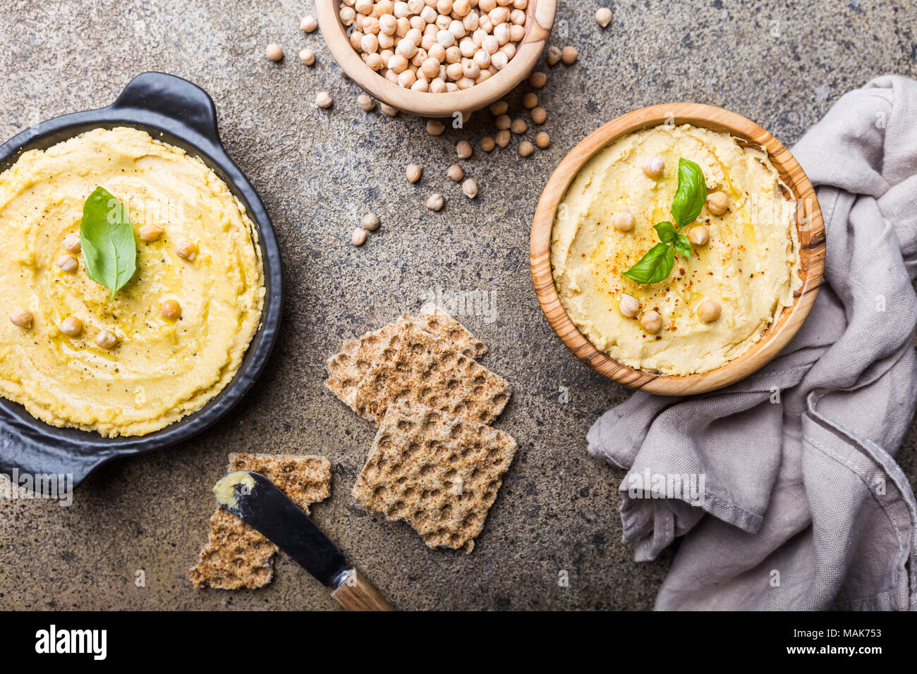 Healthy Homemade Creamy Hummus with Olive Oil over stone background ...