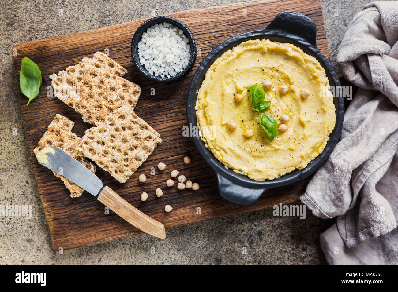 Healthy Homemade Creamy Hummus with Olive Oil over stone background ...