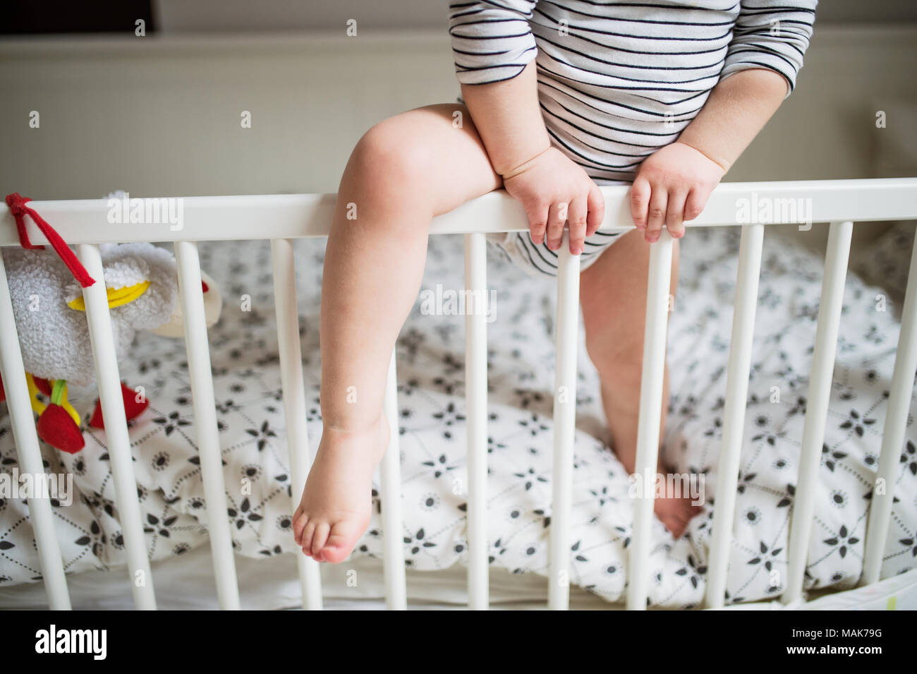 Toddler boy in a dangerous situation at home Stock Photo - Alamy