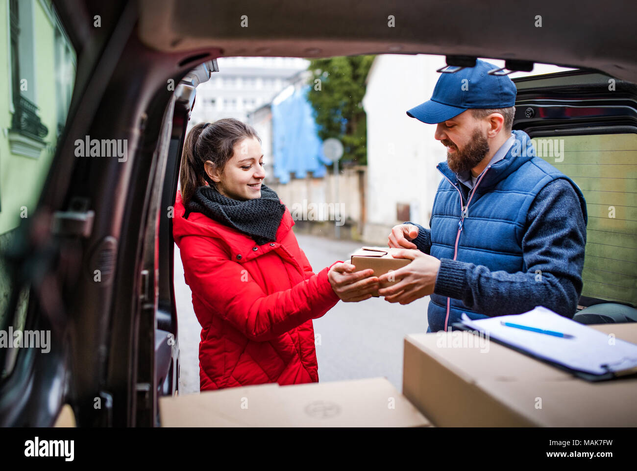 Female customer receiving boxes hi-res stock photography and images - Alamy