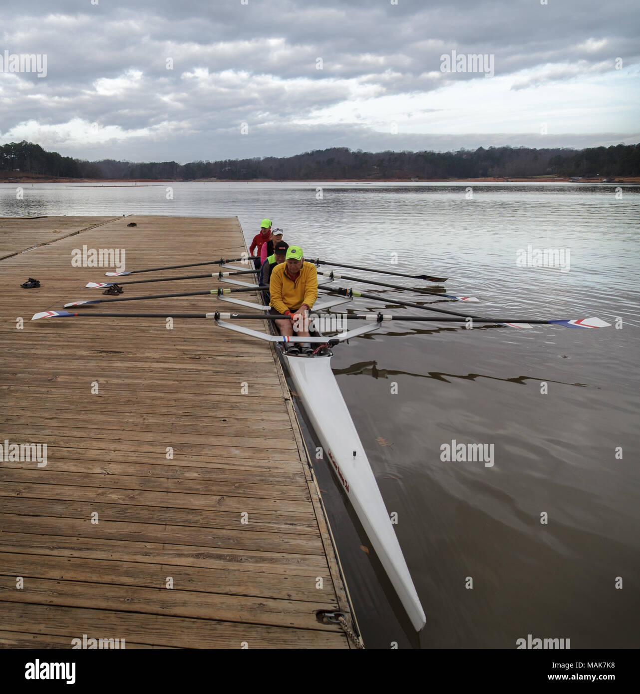 Members of the local boating club preparing to row on Lake Lanier at ...