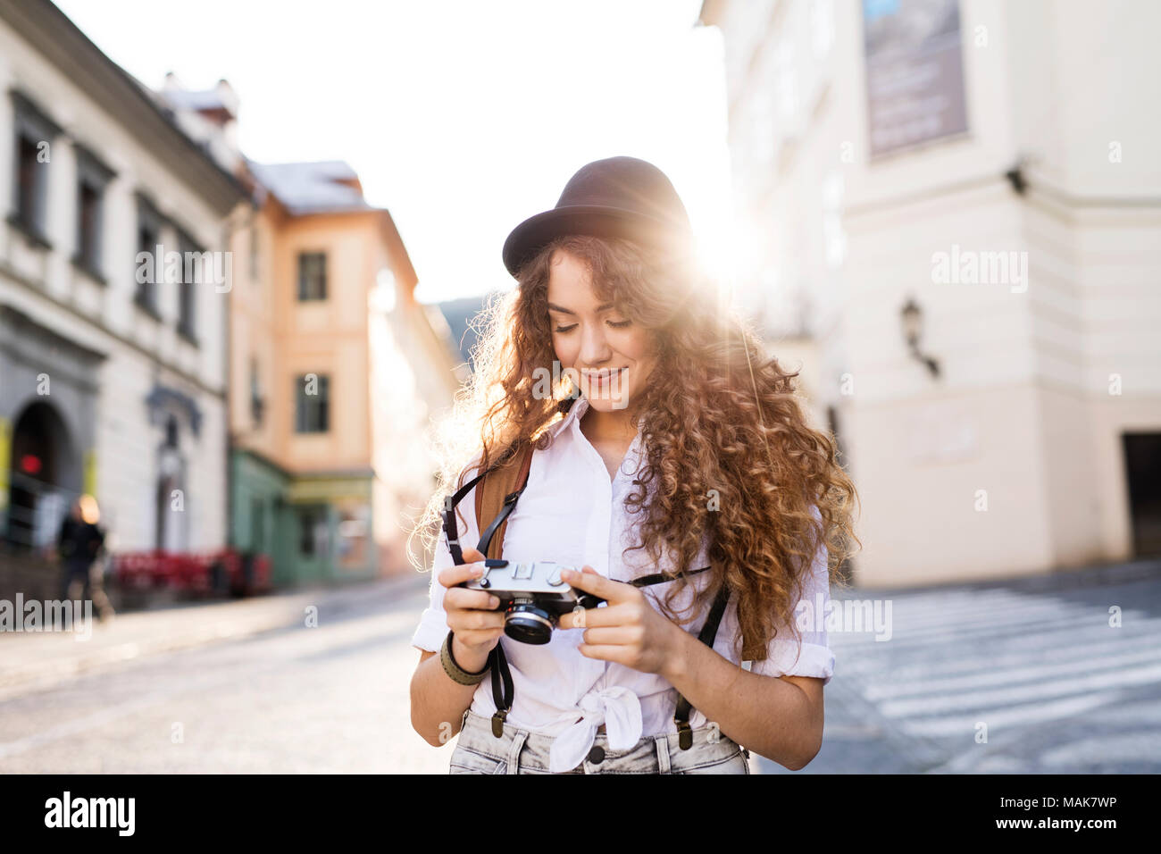 Young tourist with camera in the old town Stock Photo - Alamy