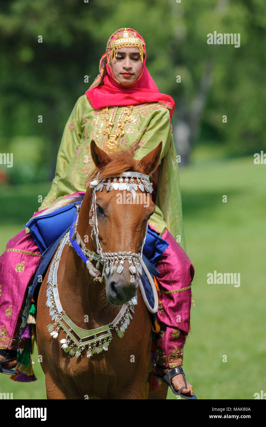 Members of the Arab show group "Royal Cavalry of Oman" ride in ...