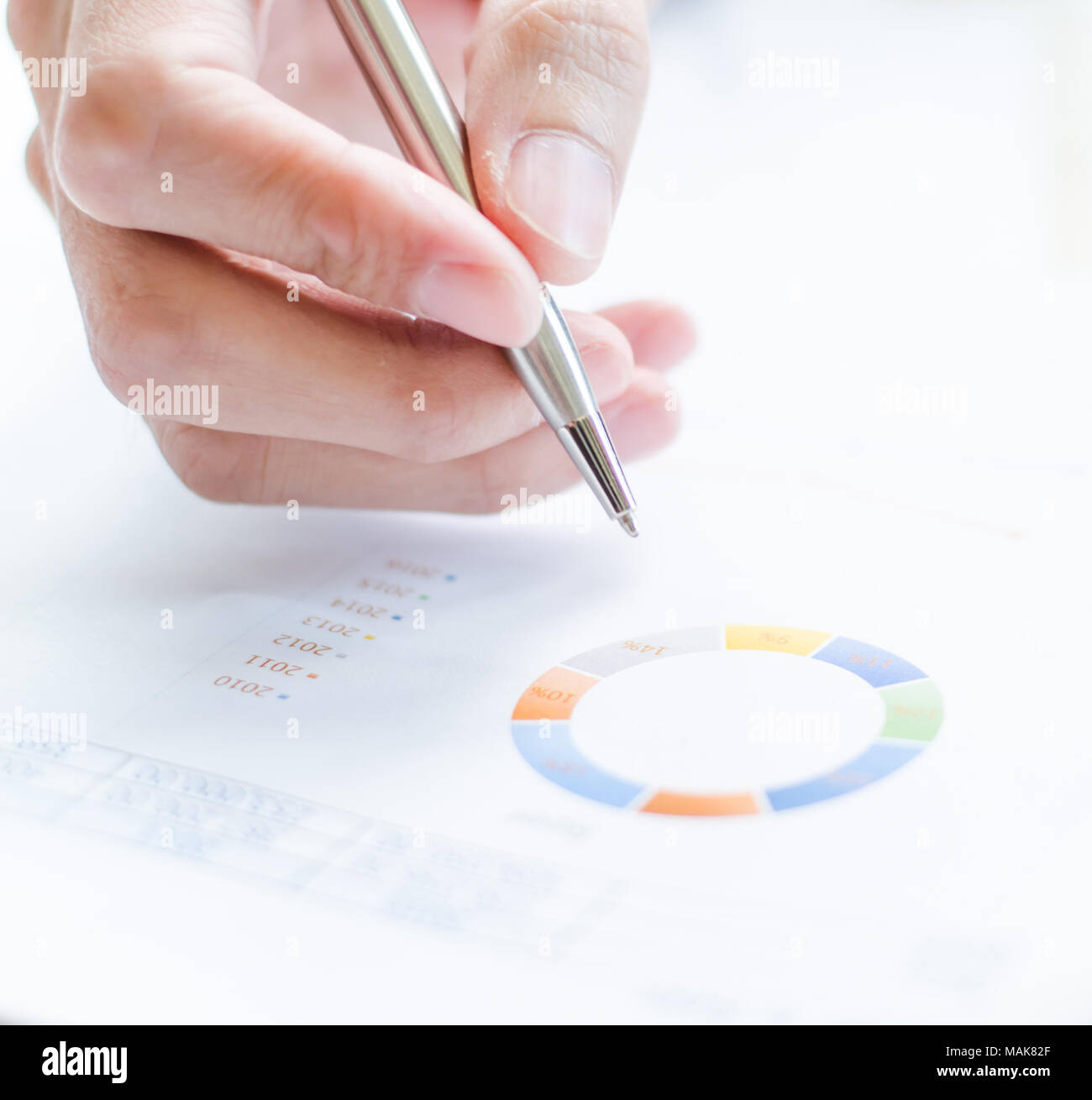 woman hand with pen and business report Stock Photo - Alamy